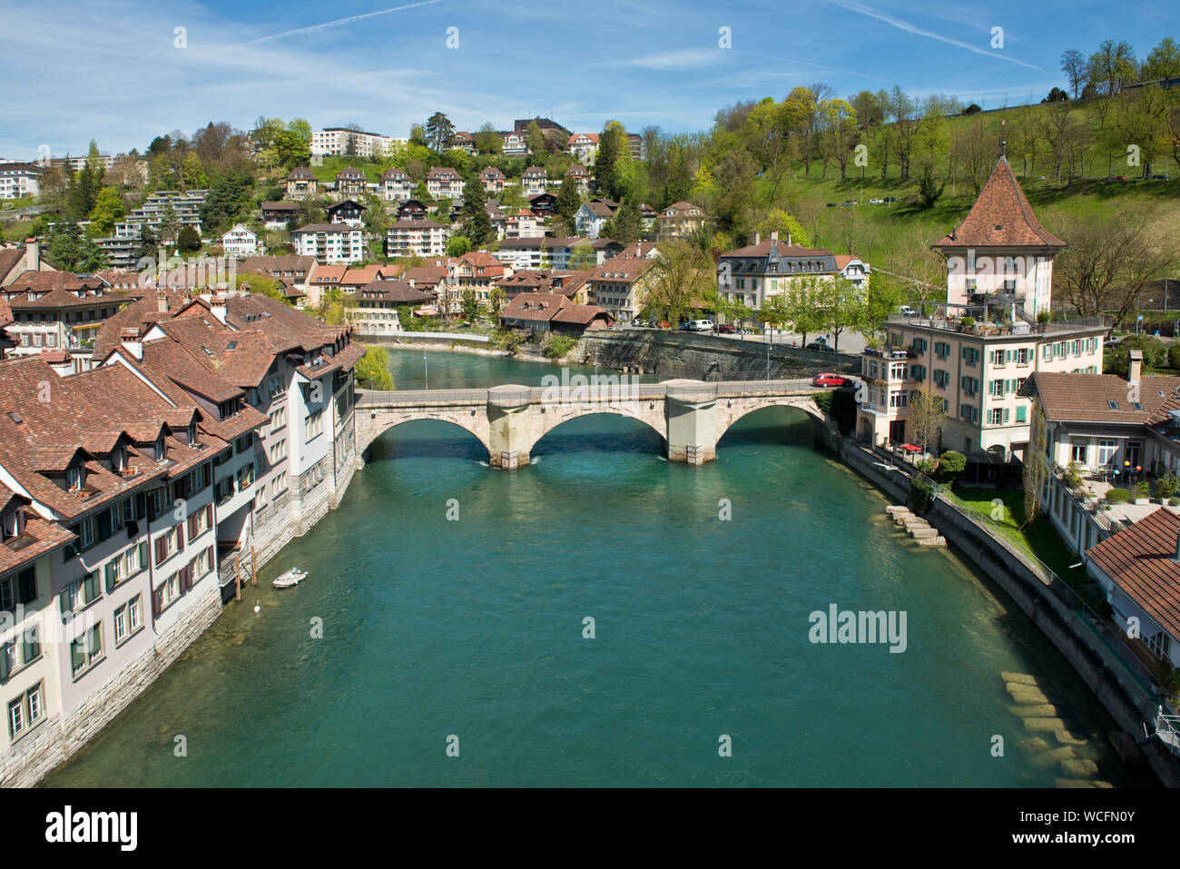 View along River Aare toward the old Untertobrucke Bridge. Bern ...