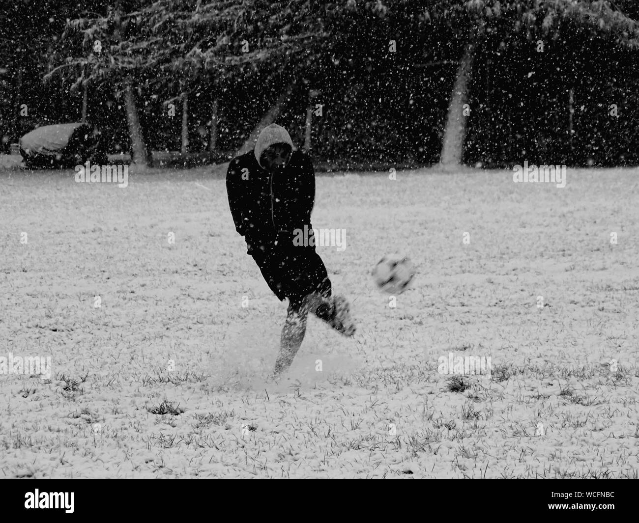 Man playing soccer on snow hi-res stock photography and images - Alamy