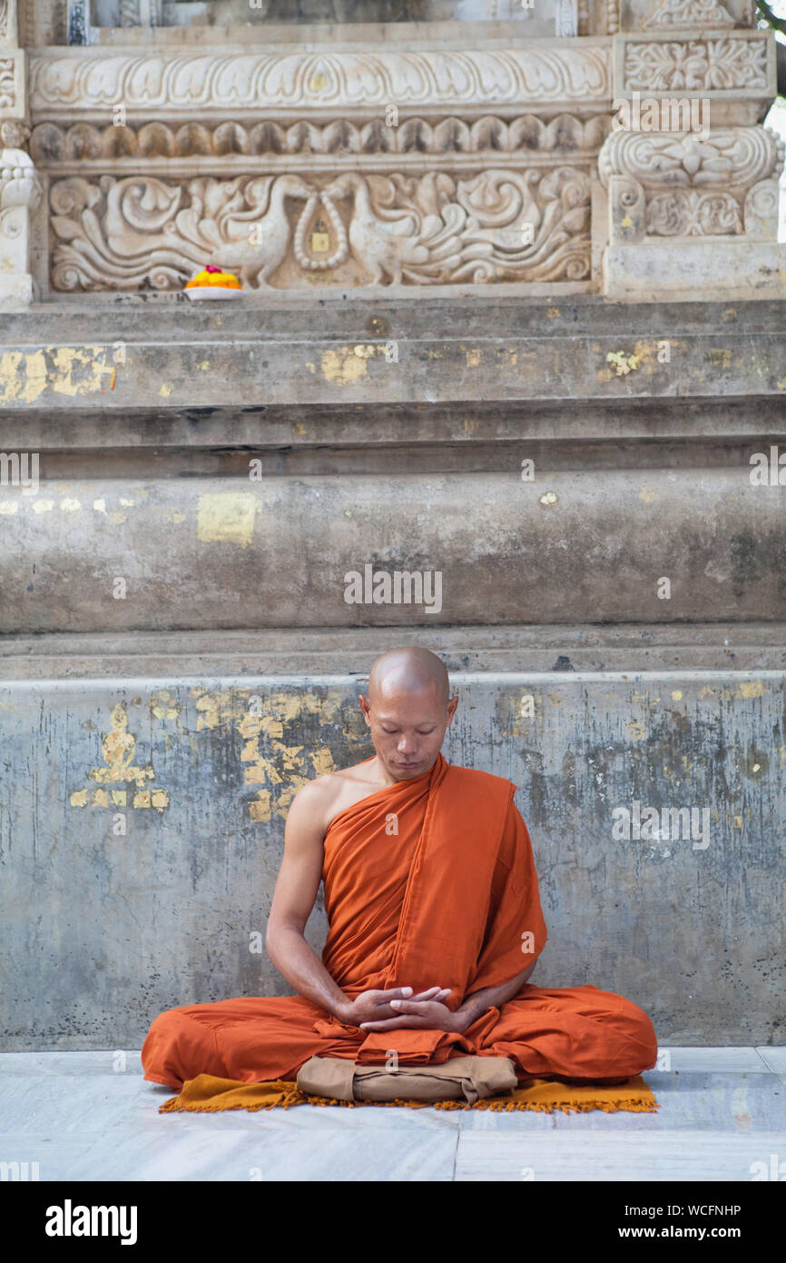 India, Bihar, Bodhgaya, A Buddhist Monk in meditation at the Mahabodhi ...