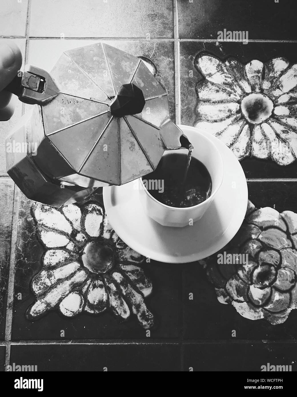 Hand pouring pot hi-res stock photography and images - Alamy