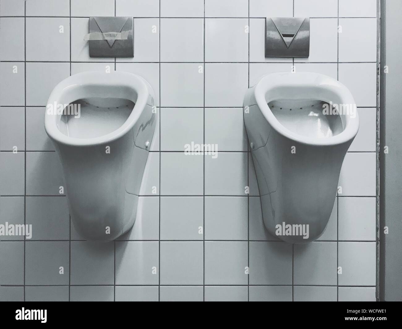 White urinals hi-res stock photography and images - Alamy