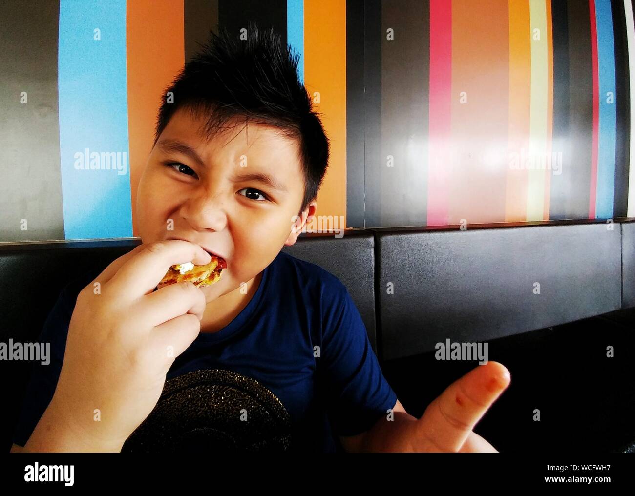 Boys eating in a restaurant hi-res stock photography and images - Alamy