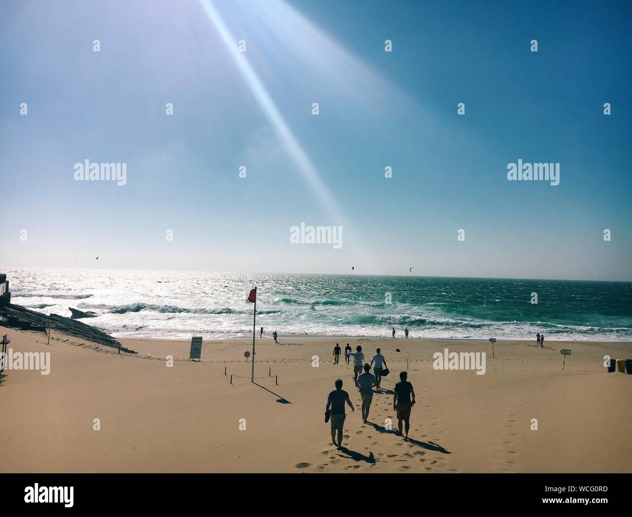 People Walking On Beach Stock Photo - Alamy