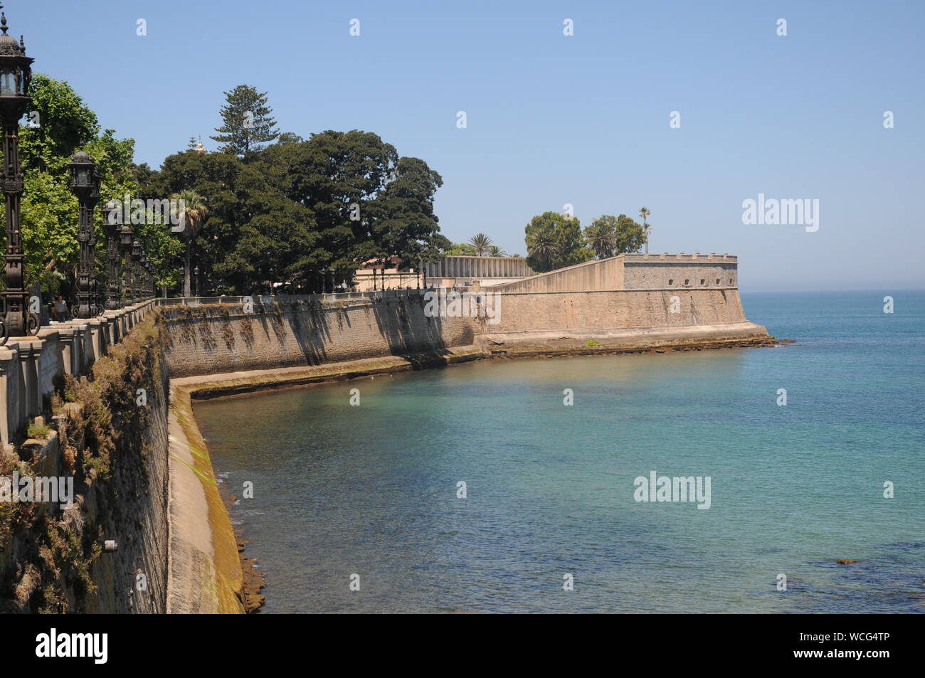 The remains of the city walls with the landscaped promenade and public ...
