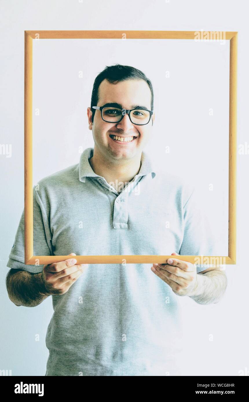 Man holding empty frame hi-res stock photography and images - Alamy