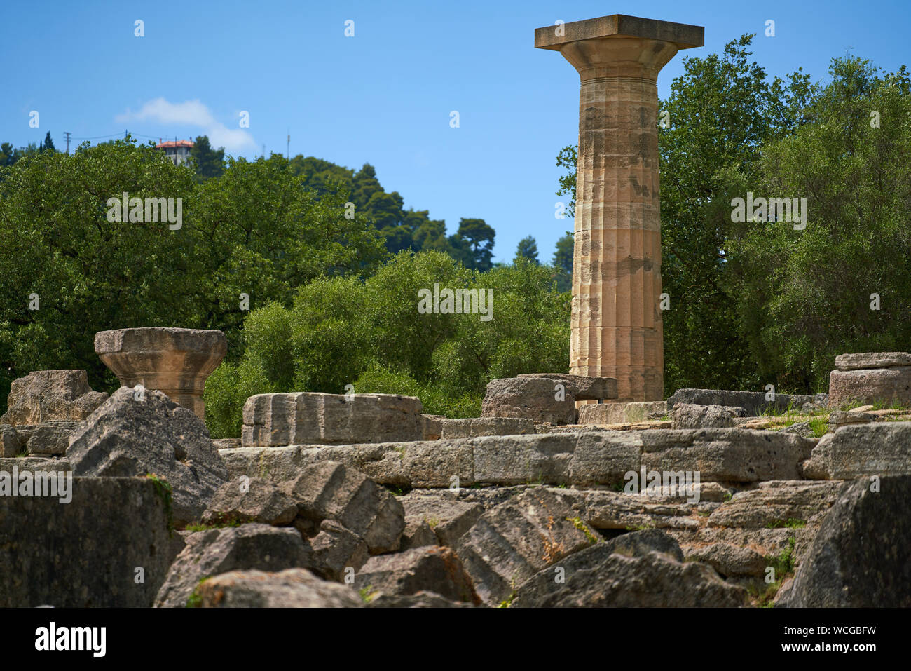 Remains of the Temple of Zeus at Olympia with a single reconstructed ...