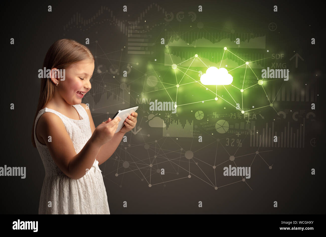 Adorable girl working on tablet with cloud technology concept Stock ...