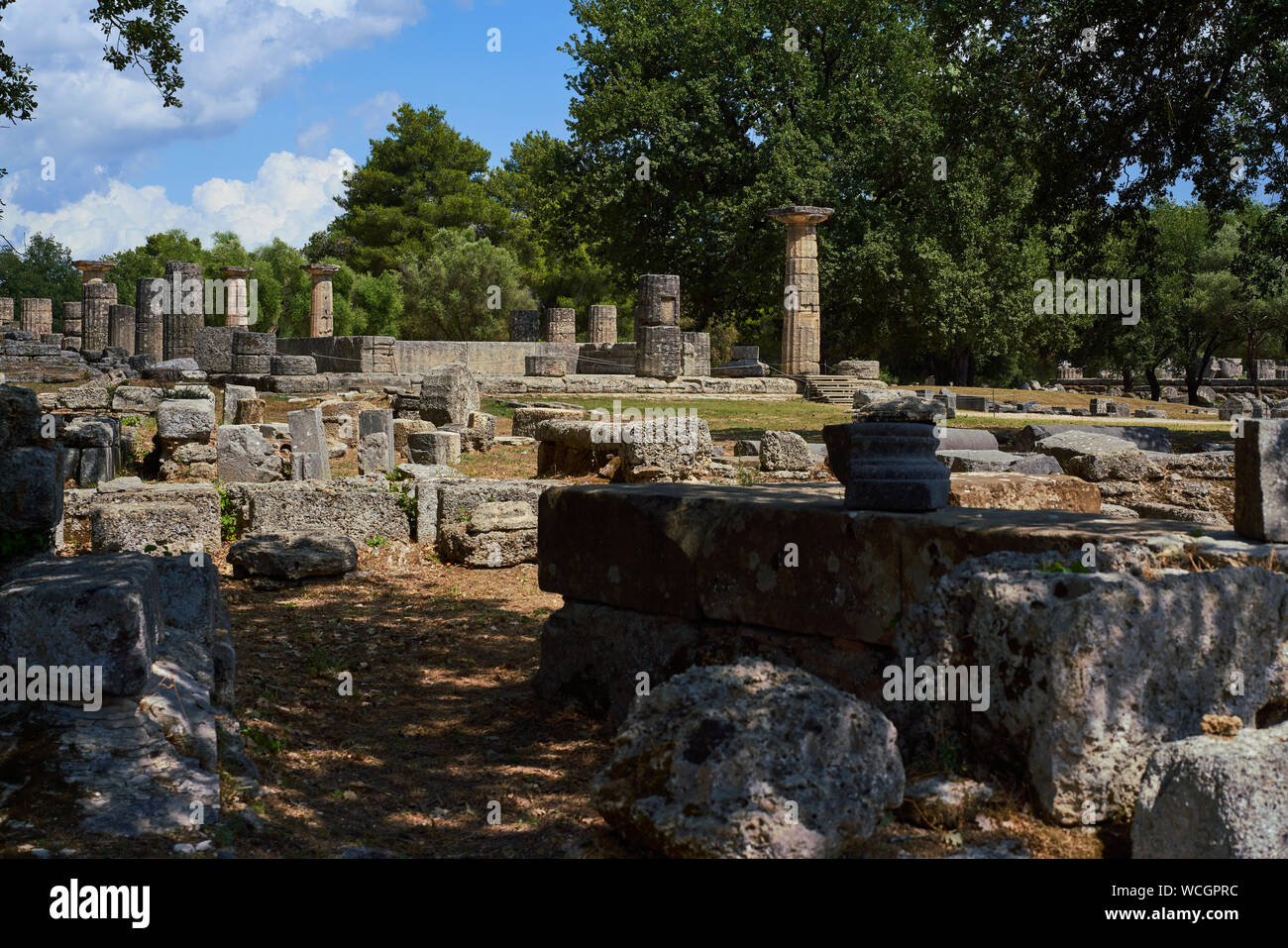 Remains of the Temple of Zeus at Olympia with a single reconstructed ...