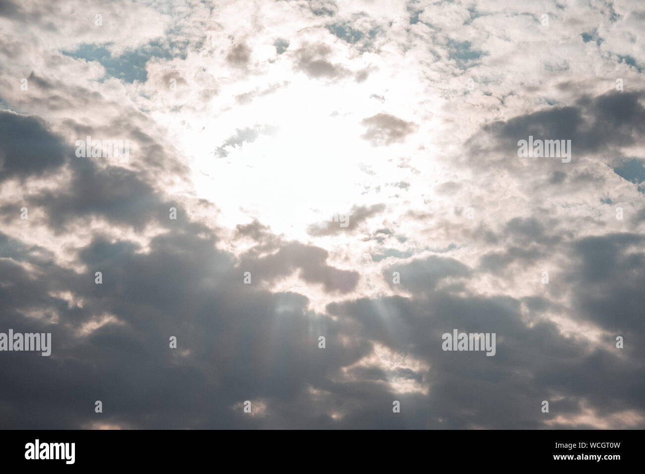 Clouds and the sun shine through the rays of light in the lighted rays ...