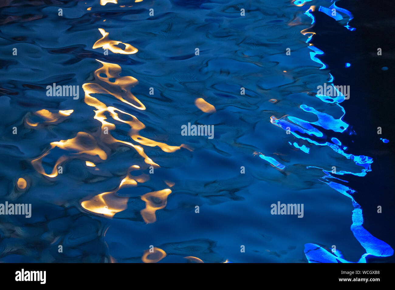 electric blue reflections in water Stock Photo - Alamy
