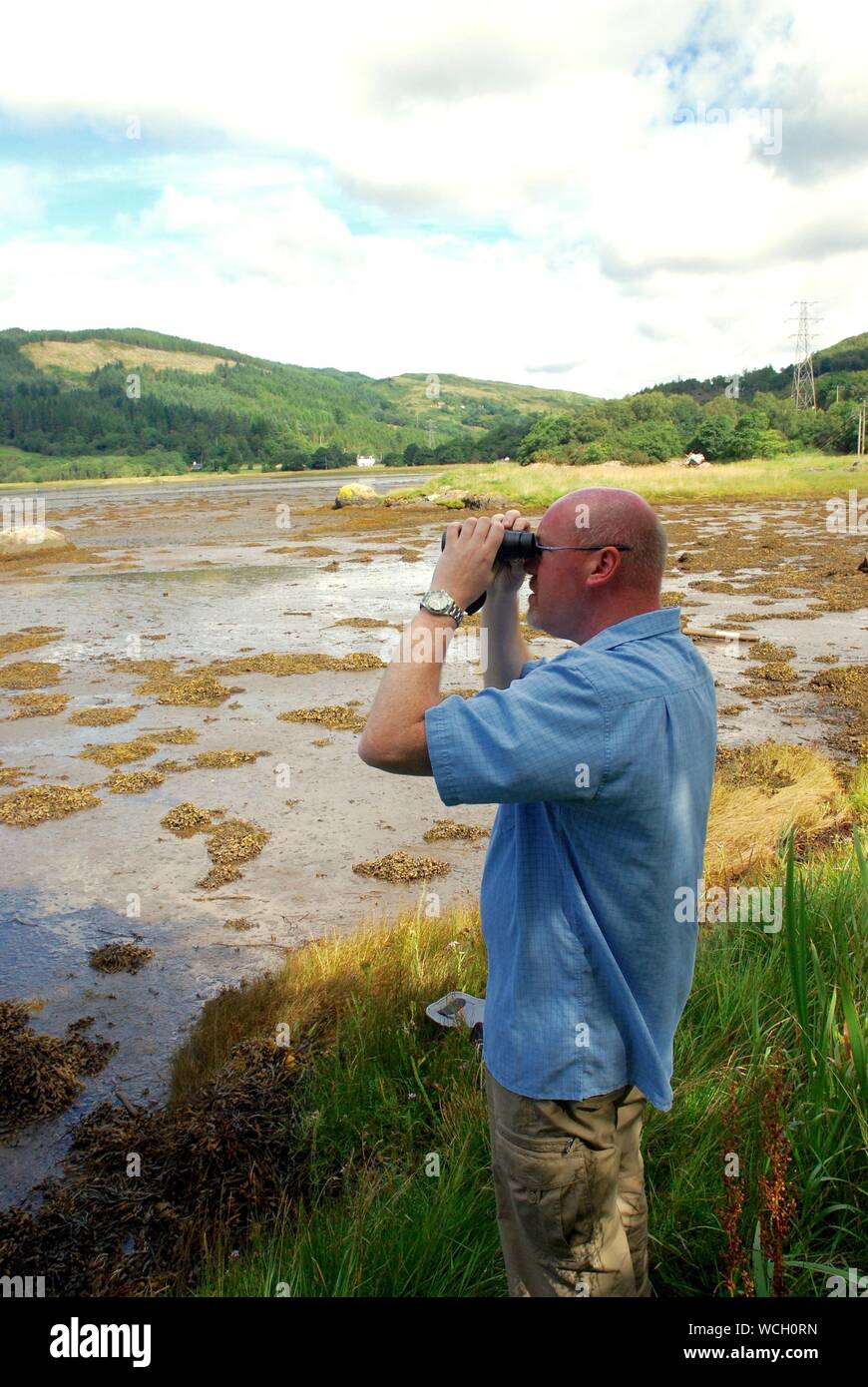 Man With Binoculars Tree High Resolution Stock Photography and Images ...