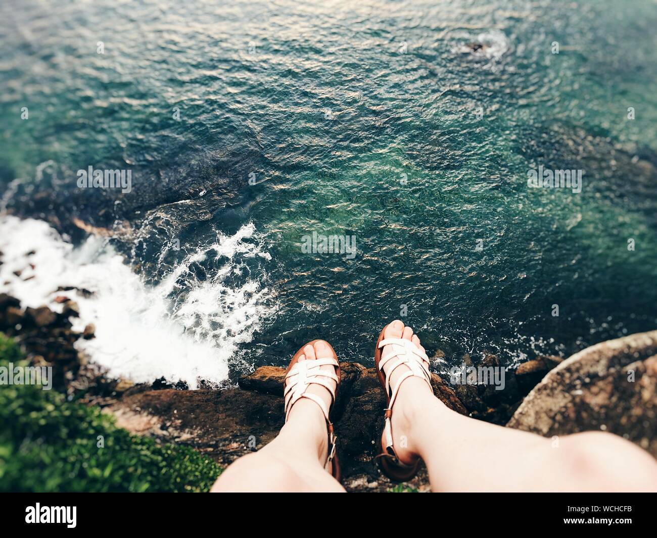 Women dangling legs hi-res stock photography and images - Alamy