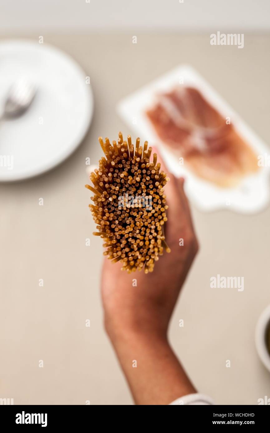 Hand with spaghetti hi-res stock photography and images - Alamy