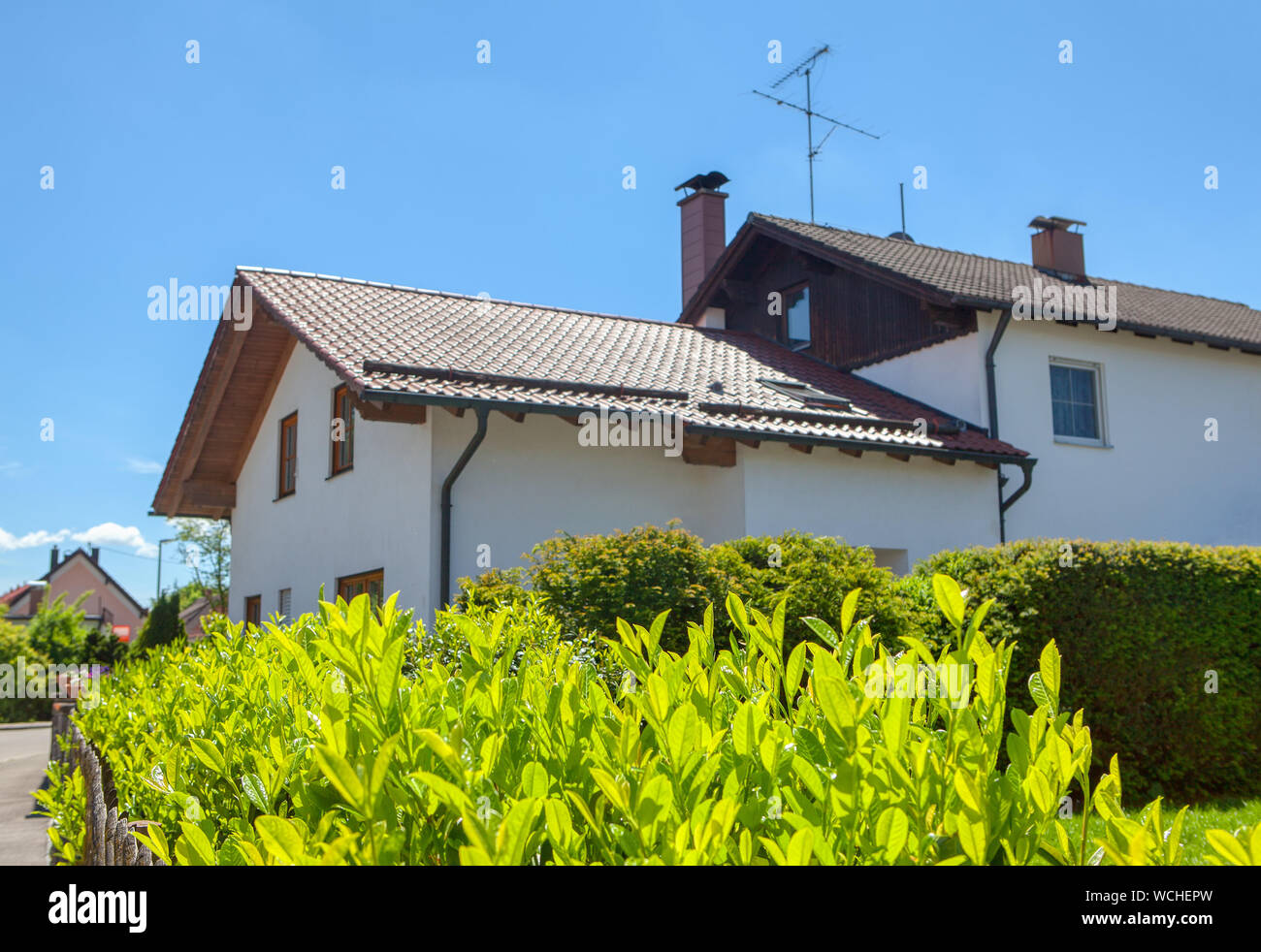 side view of rustic house with garden Stock Photo - Alamy