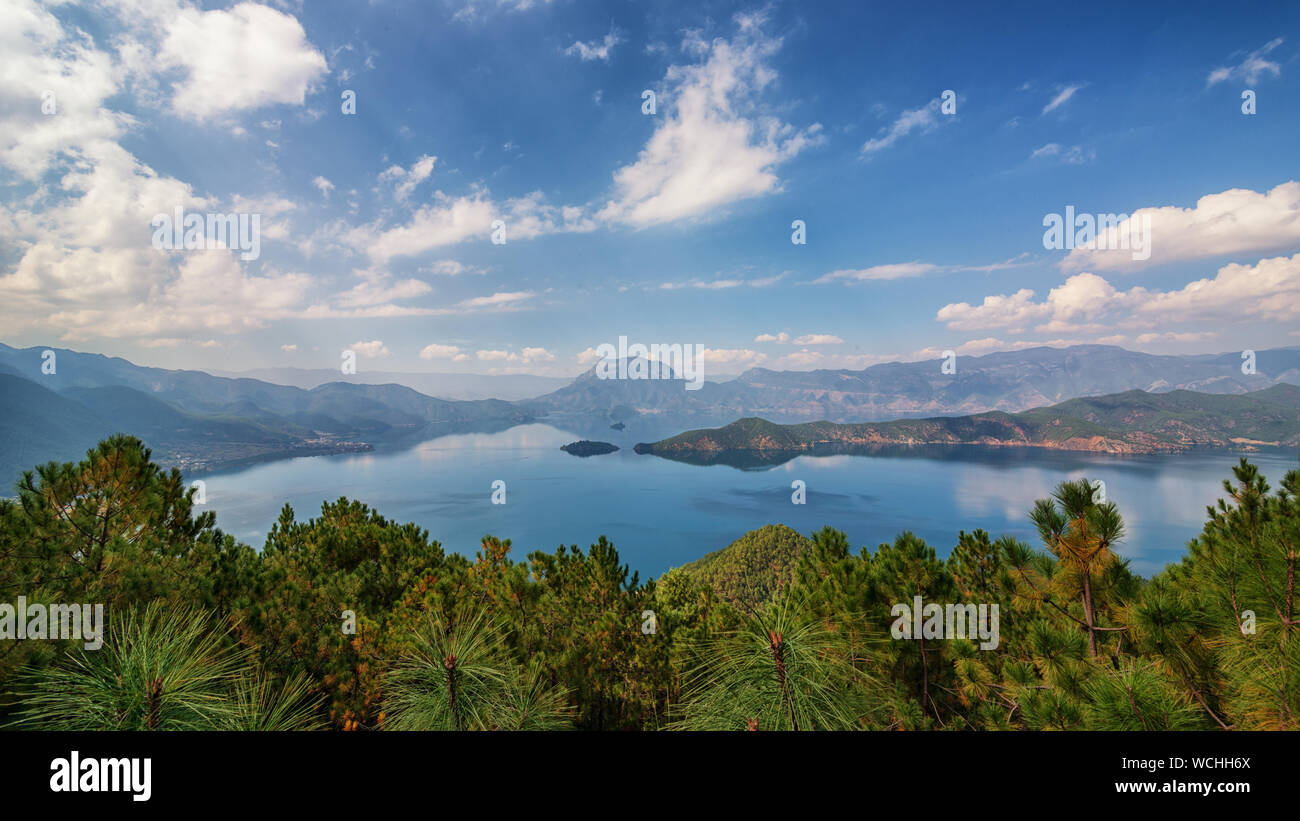 cinematic view of beautiful lake with green forest and mountain Stock ...