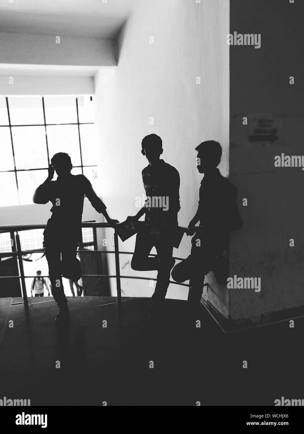 Friends standing on balcony hi-res stock photography and images - Alamy