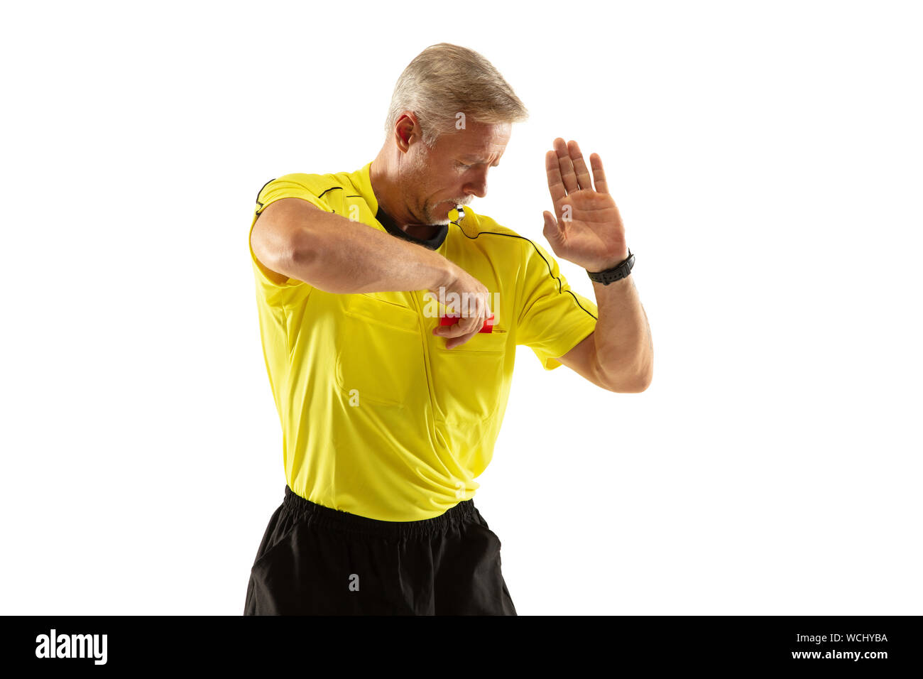 Referee showing a red card and gesturing to a football or soccer player ...