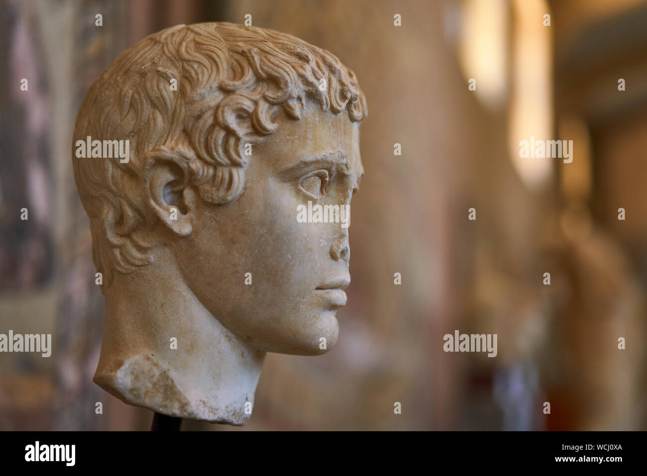 Ancient Greek and Roman statues on display in the museum in Corinth ...