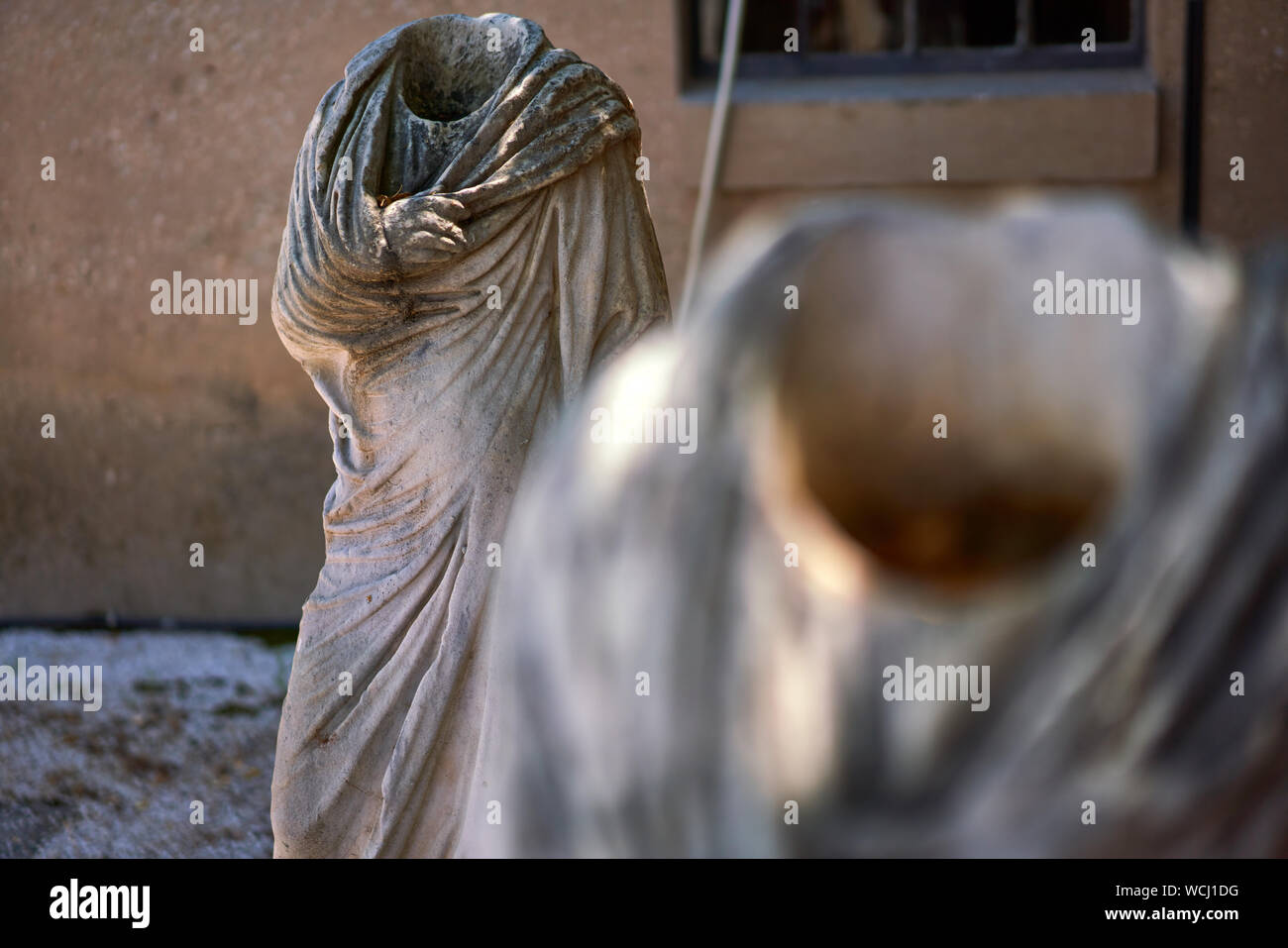 Ancient Greek and Roman statues on display in the museum in Corinth ...