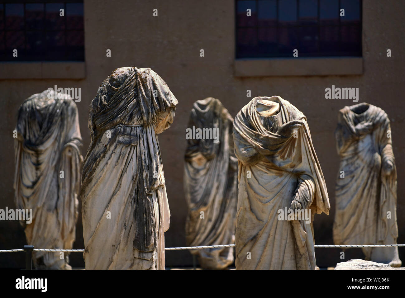 Ancient Greek and Roman statues on display in the museum in Corinth ...