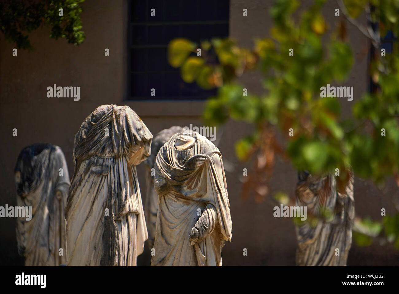 Ancient Greek and Roman statues on display in the museum in Corinth ...