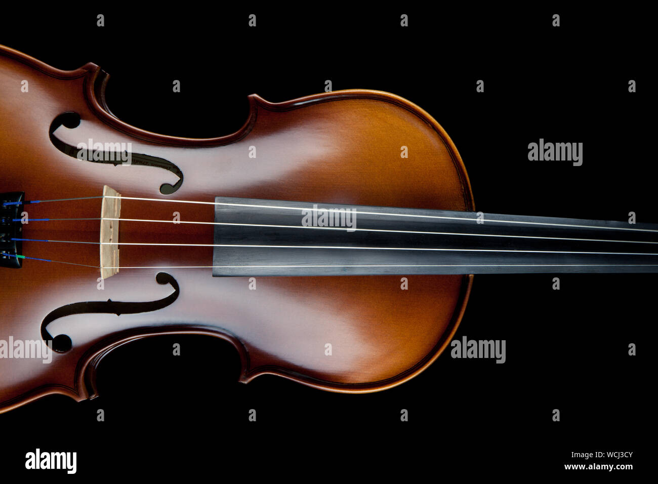 Classical violin isolated on black Stock Photo - Alamy