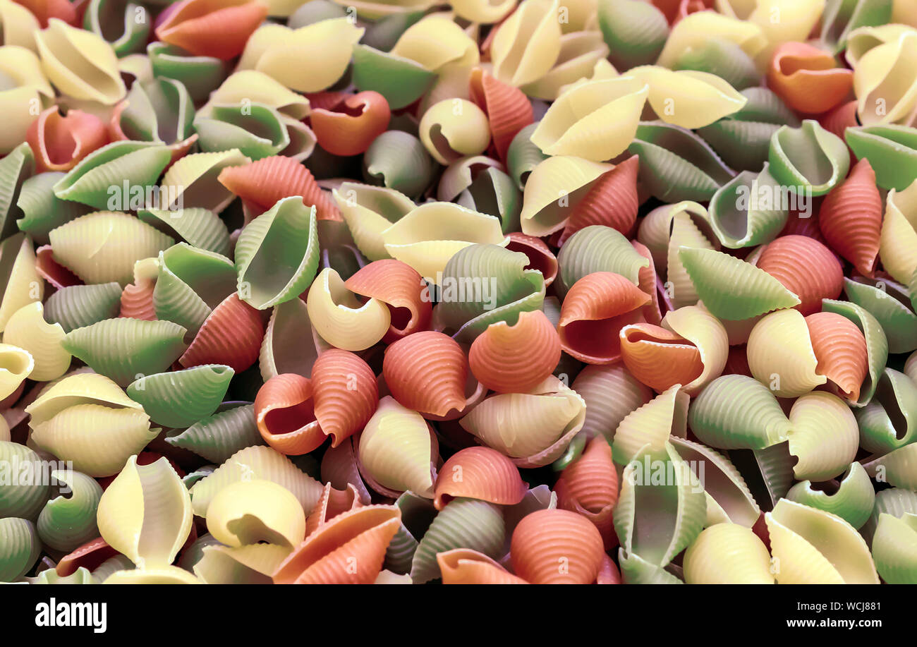 Colorful Italian pasta on the shop counter. Background made of pasta ...