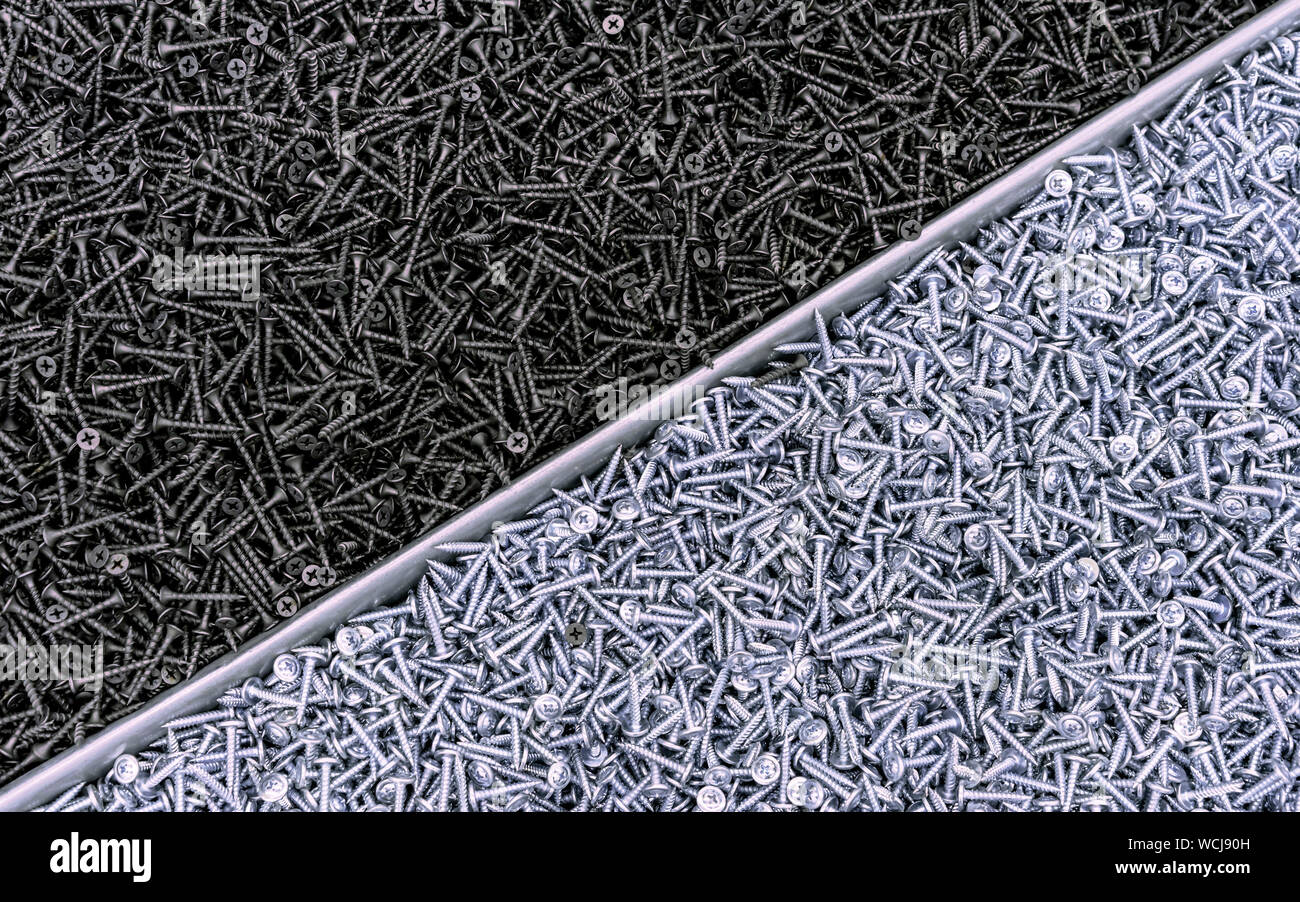 Chrome screws on the counter of a hardware store. Background of the ...