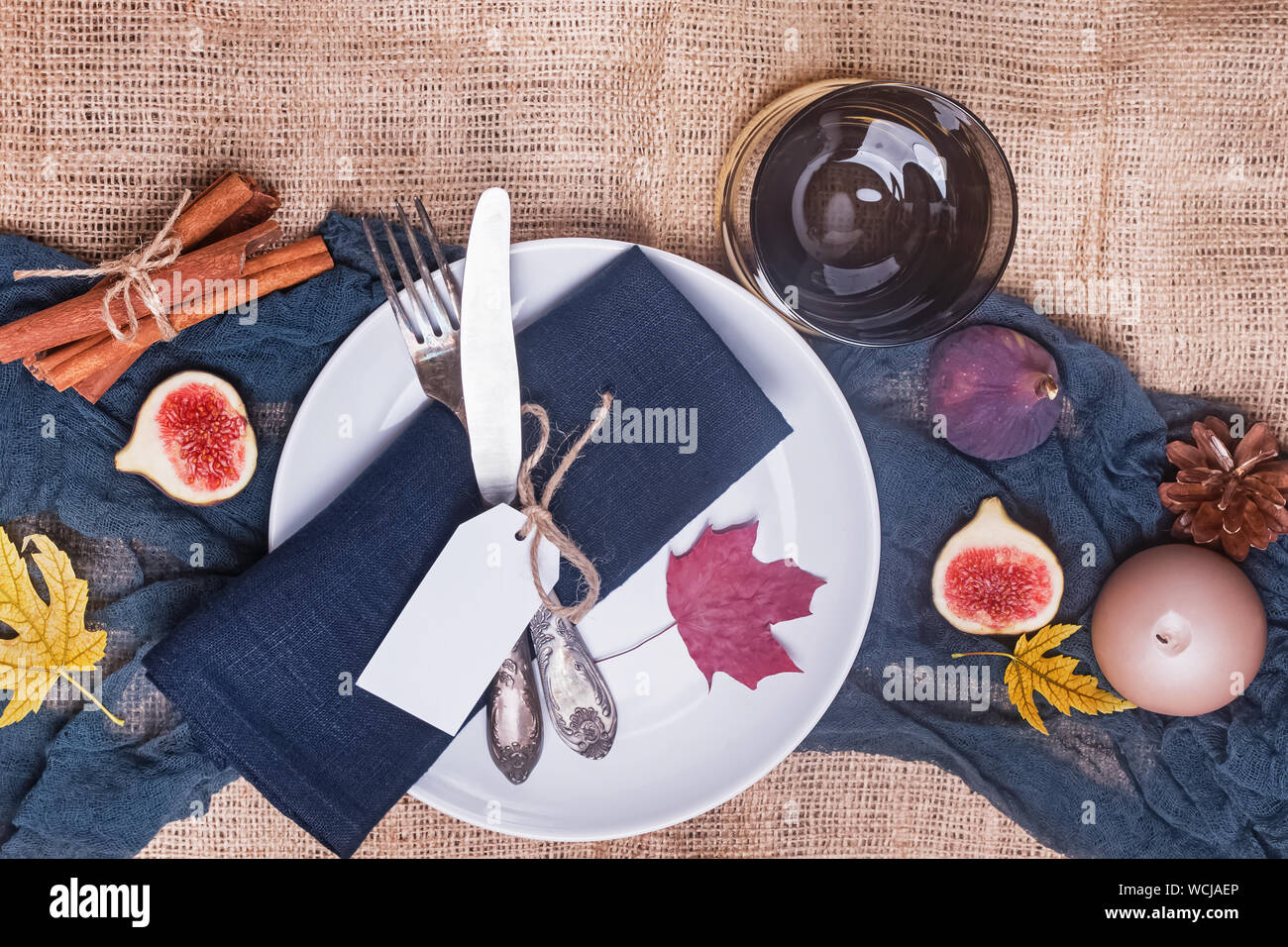 Table decorated with autumn fruits, leaves and spices. Thanksgiving day ...