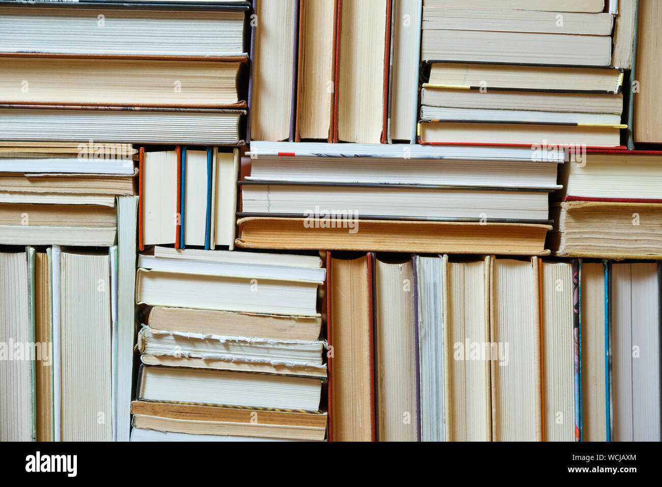 Books stack texture and background Stock Photo - Alamy