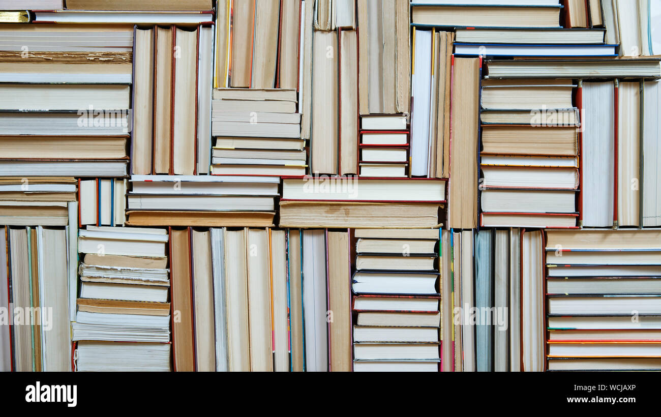 Books stack texture and background Stock Photo - Alamy
