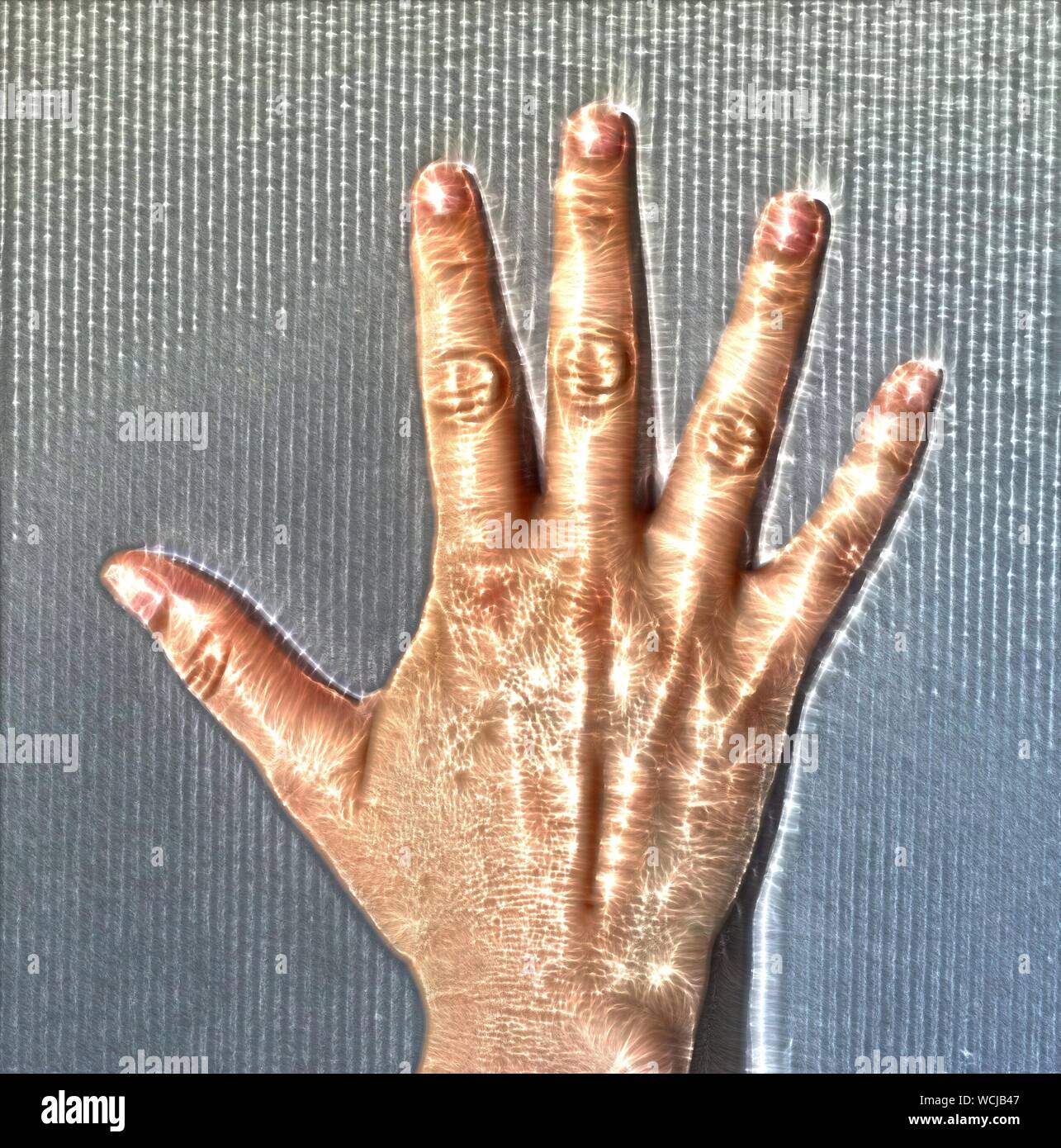 Foto of a glowing human female hand with a kirlian aura showing ...