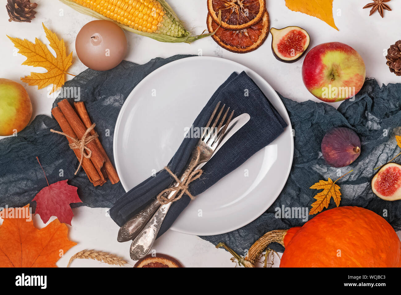 Table decorated with autumn fruits, leaves and spices. Thanksgiving day ...