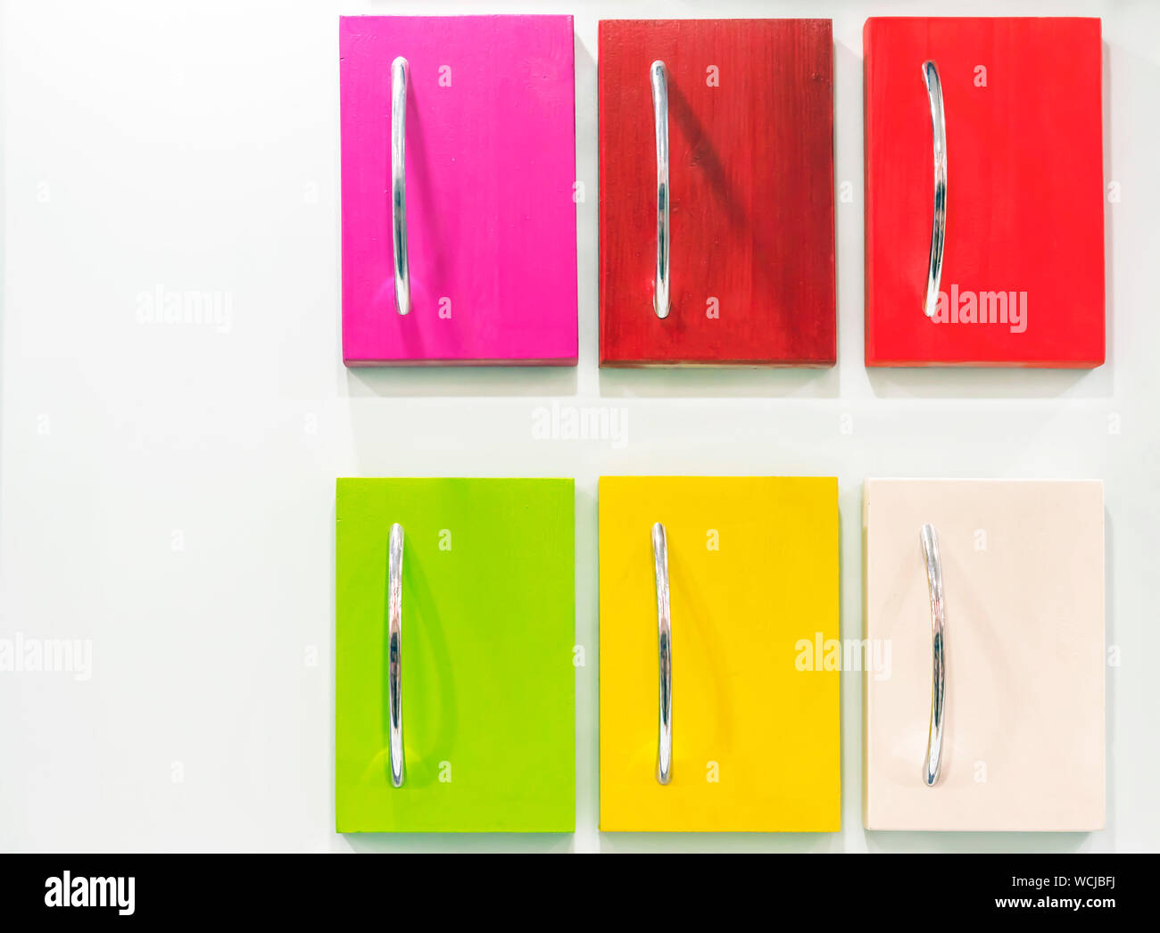 Colored drawers with metal handles on a white background Stock Photo ...