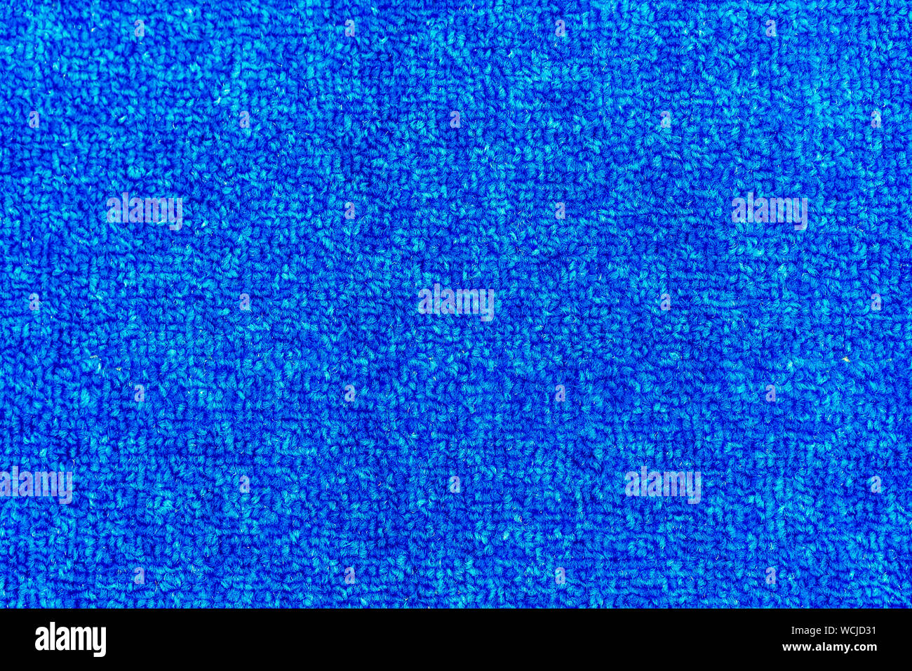 Texture of a blue carpet with dense weaving Stock Photo - Alamy