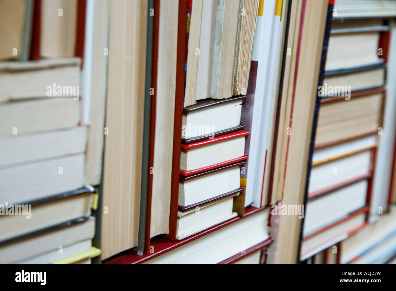 Books stack texture and background Stock Photo - Alamy