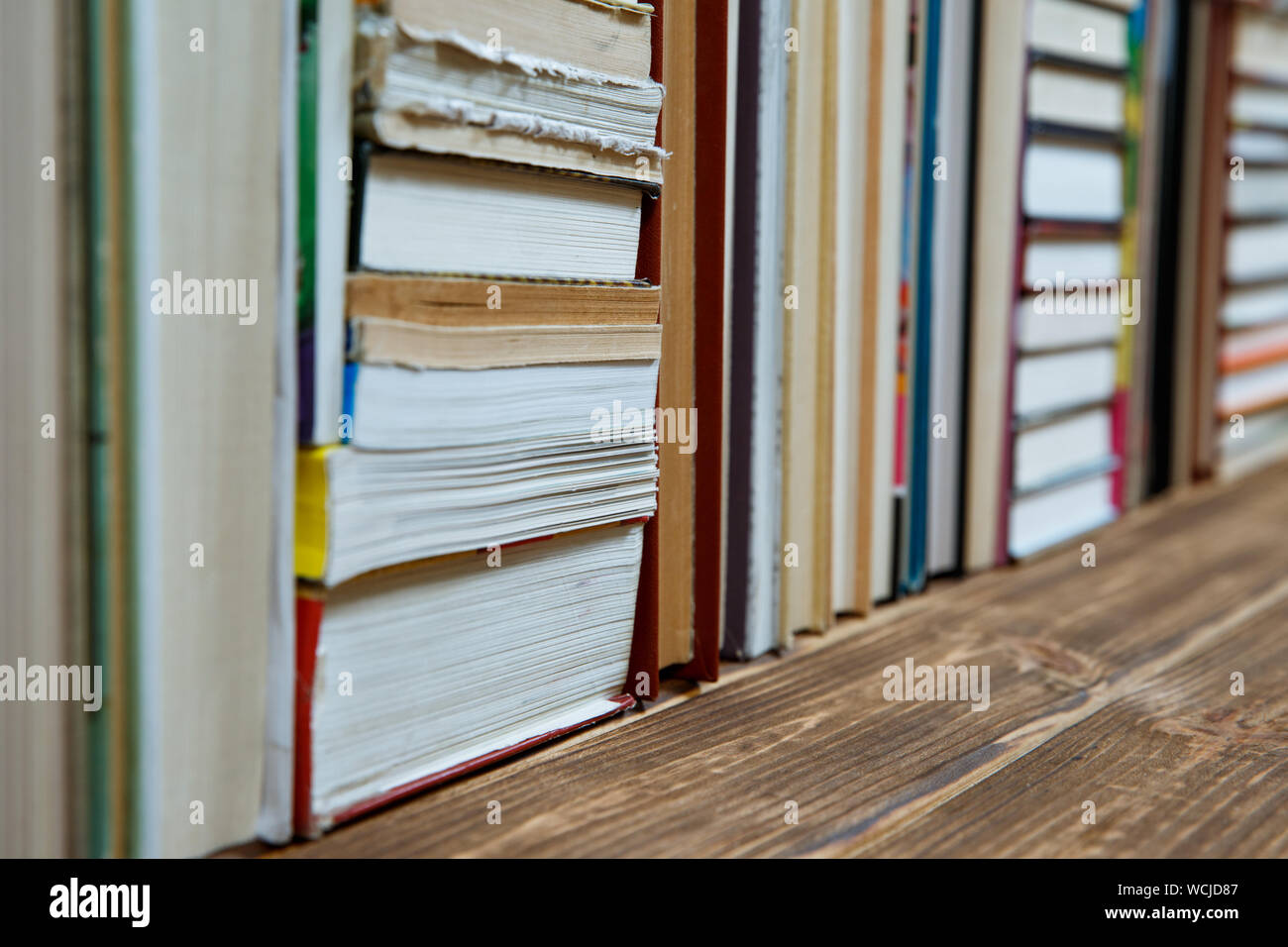 Books stack texture and background Stock Photo - Alamy
