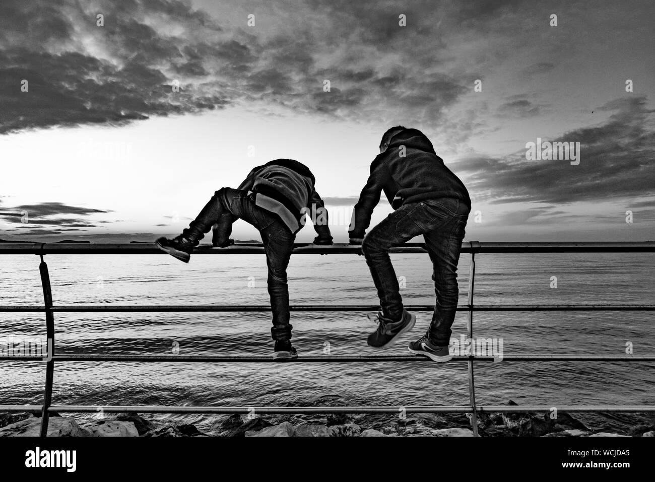 Brothers on beach Black and White Stock Photos & Images - Alamy