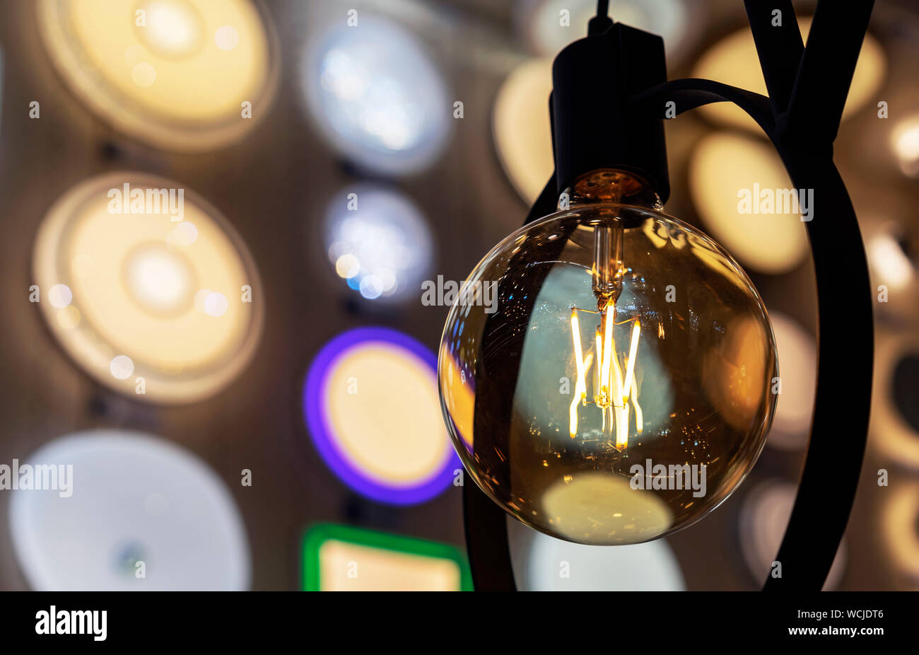Round light bulb with dark glass in a loft style Stock Photo - Alamy