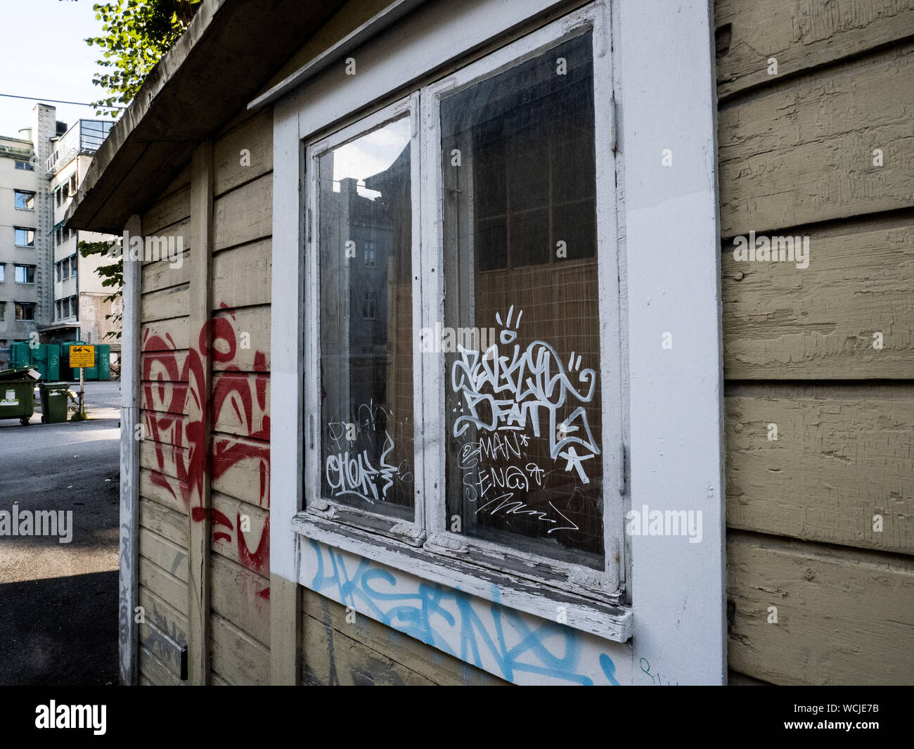 Rugged window with graffiti Stock Photo - Alamy