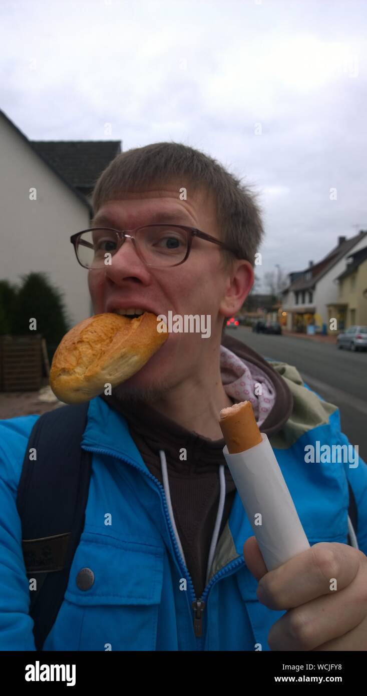 Man eating bread hi-res stock photography and images - Alamy