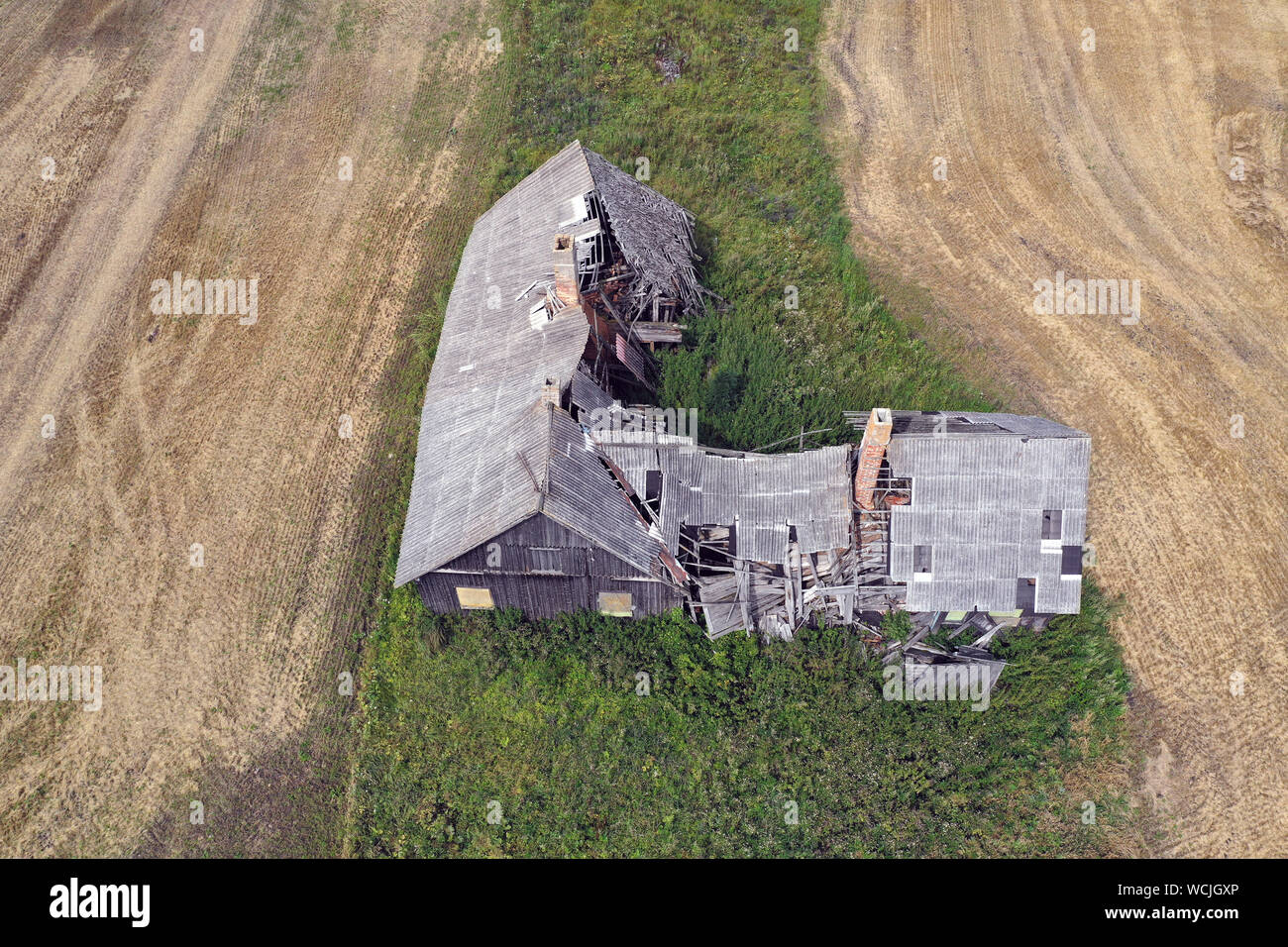 Derelict broken abandoned wooden farm house, aerial Stock Photo - Alamy