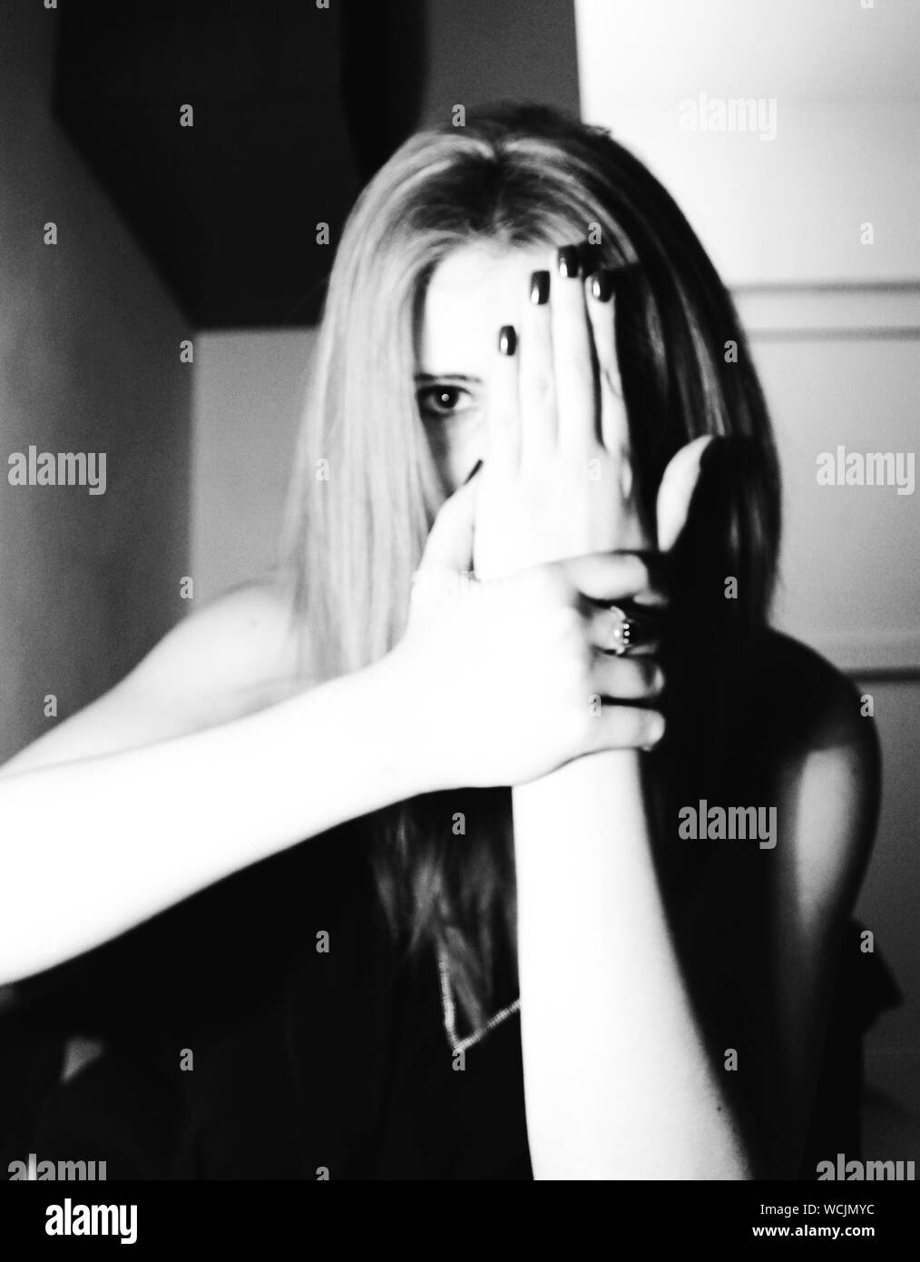 Woman hiding face by hair hi-res stock photography and images - Alamy