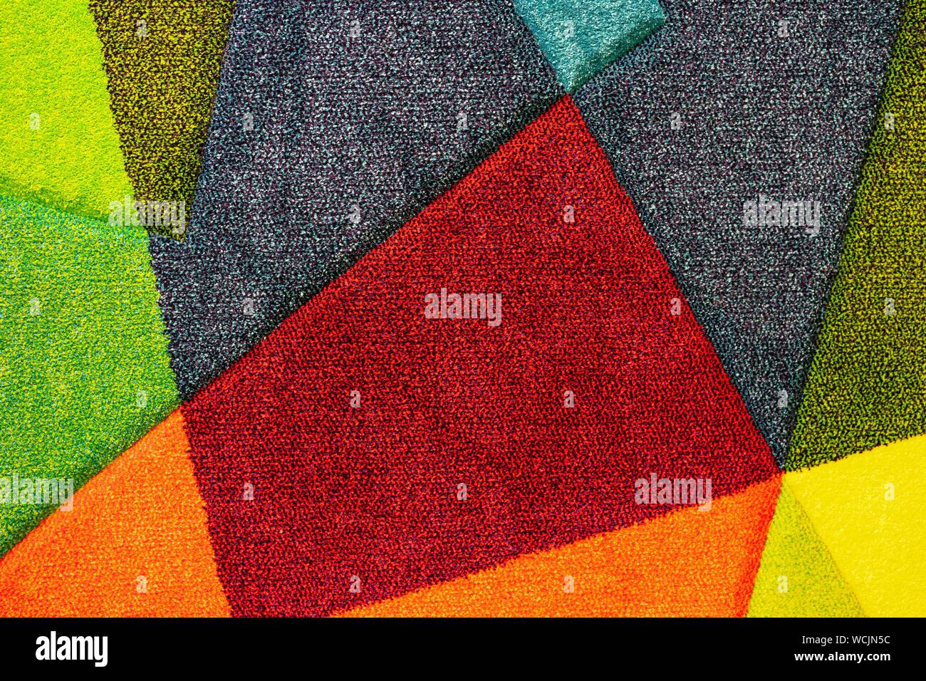 Texture of a multi-colored carpet. Background of the carpet with multi ...