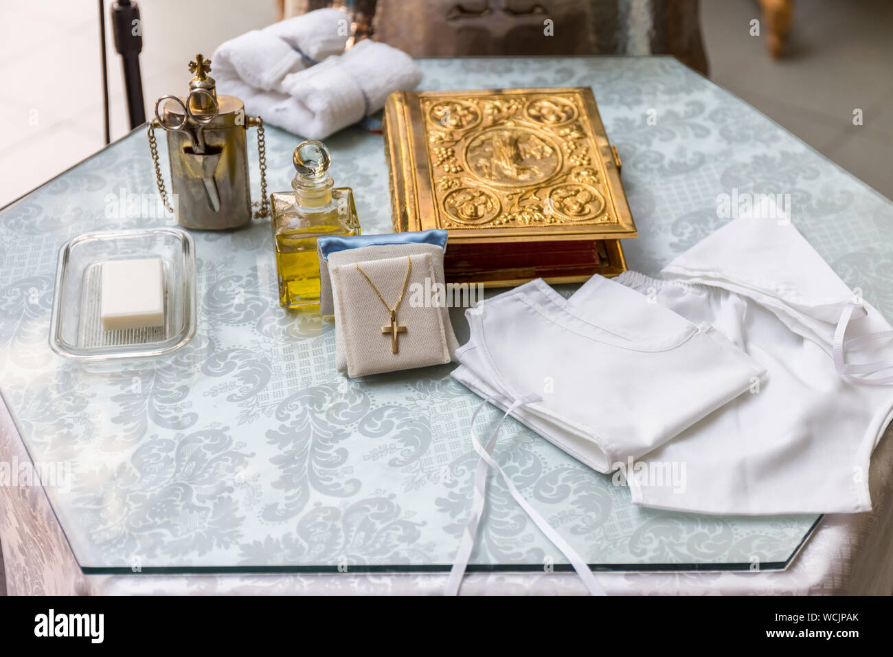 Accessories of a priest for Christian baptism Stock Photo - Alamy