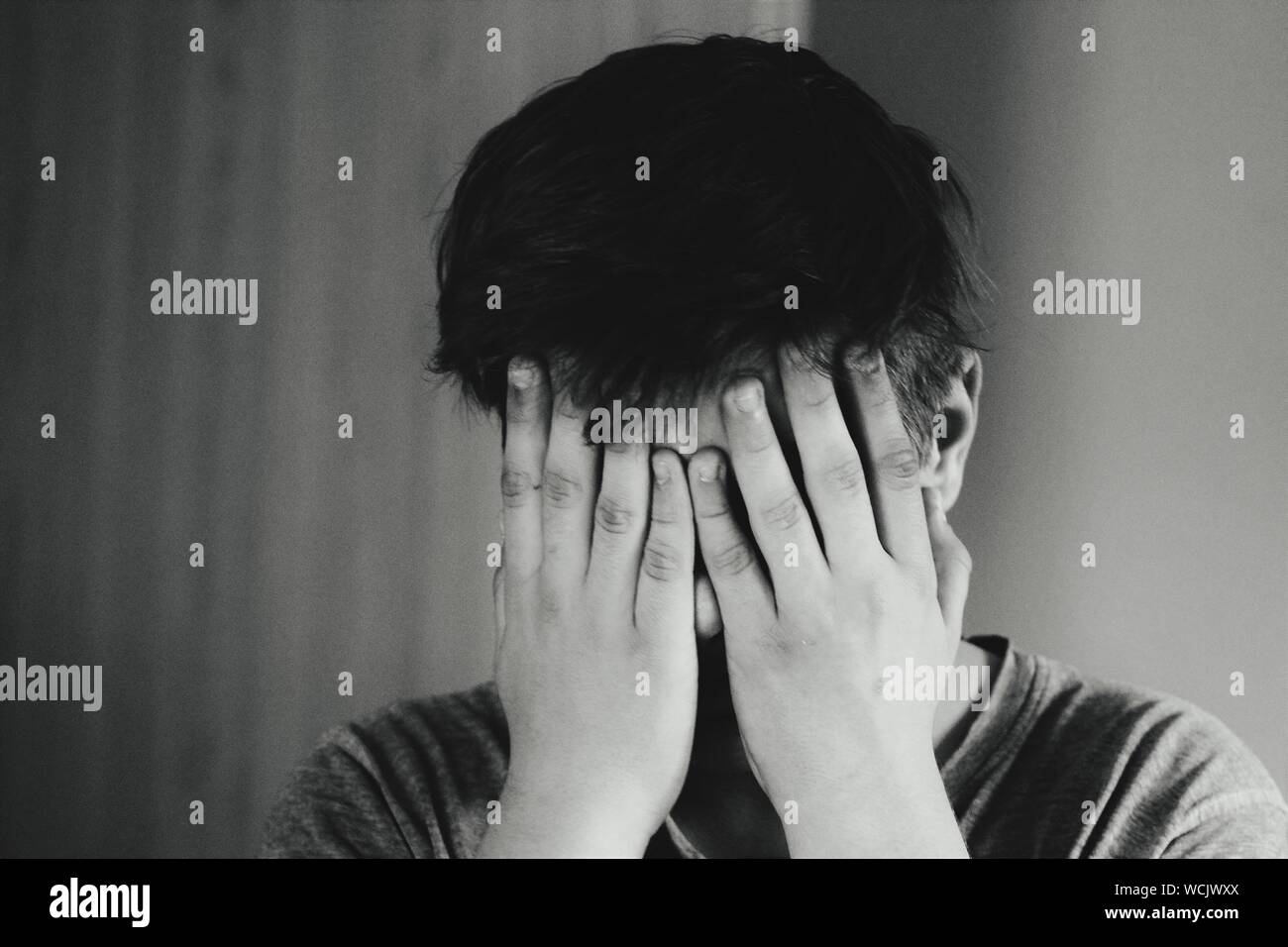 Face covered with hands hi-res stock photography and images - Alamy
