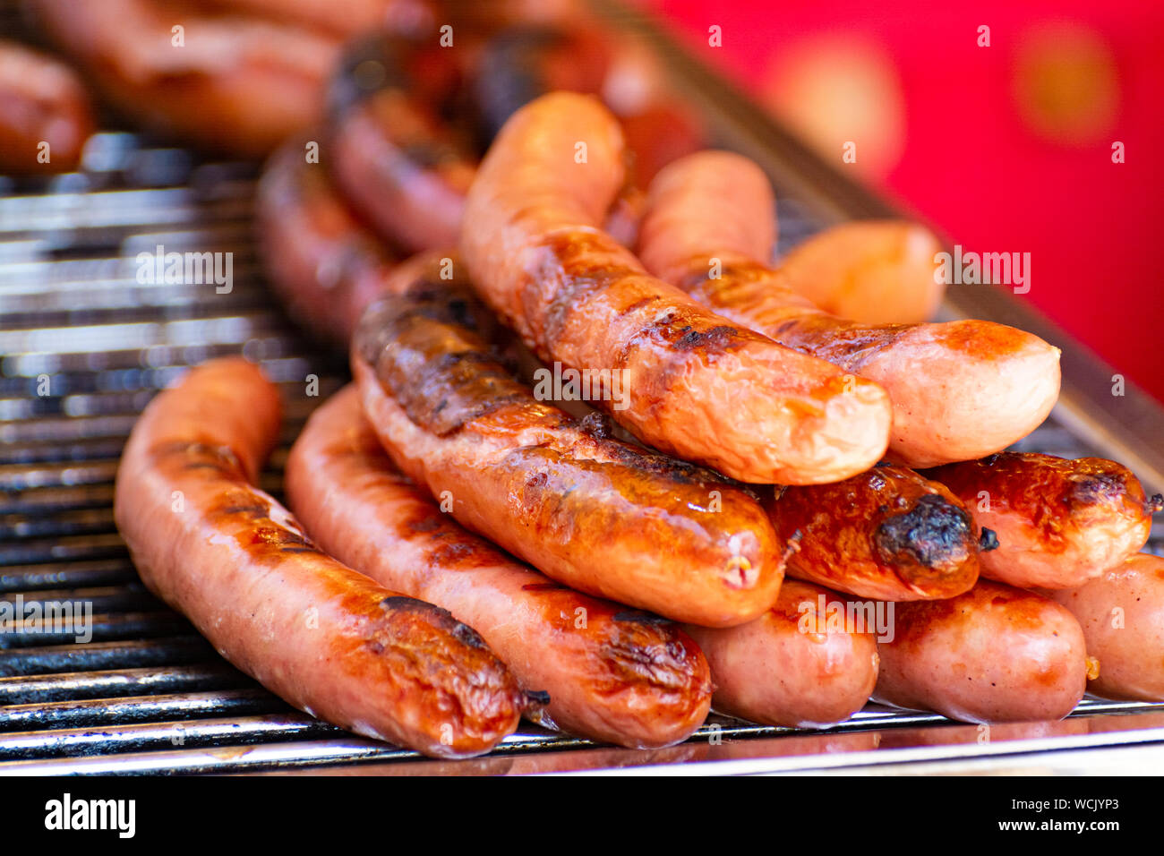German streetfood, many BBQ grilled sausages ready to eat in outdoor ...