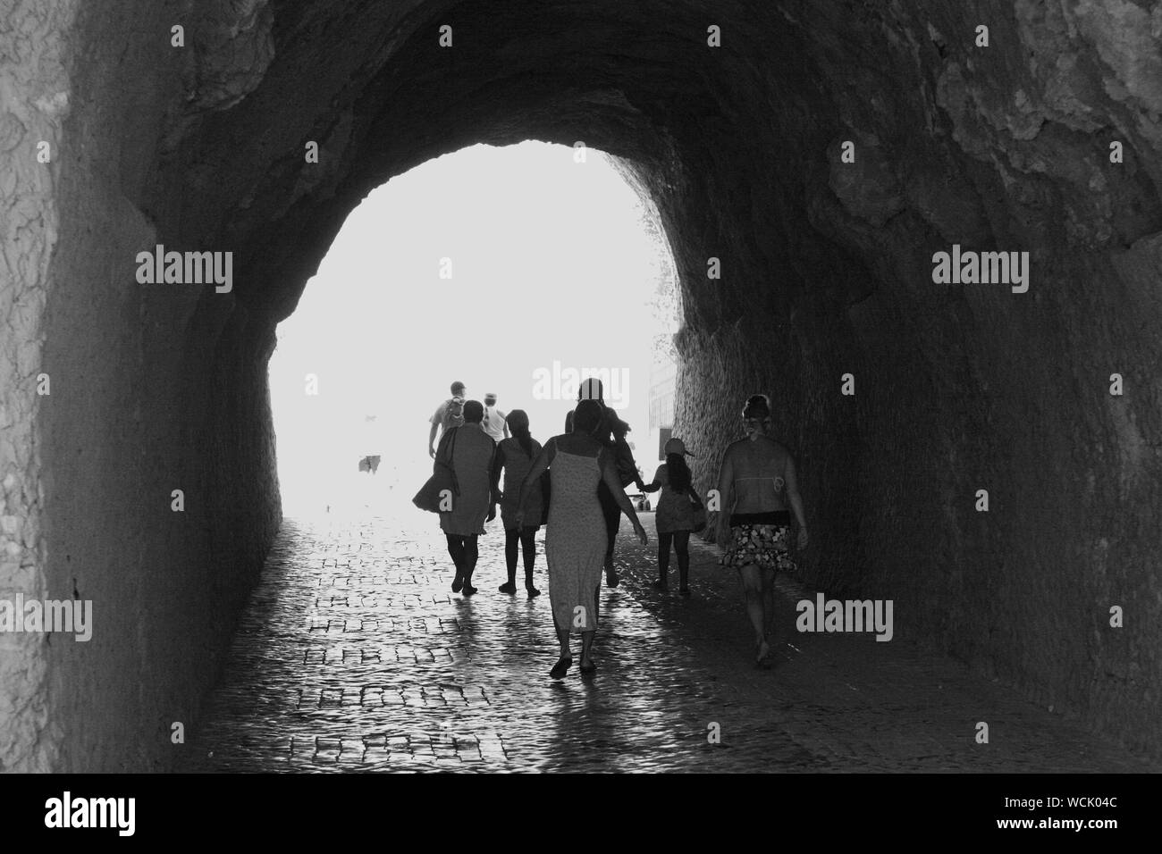 Walking under arch hi-res stock photography and images - Alamy