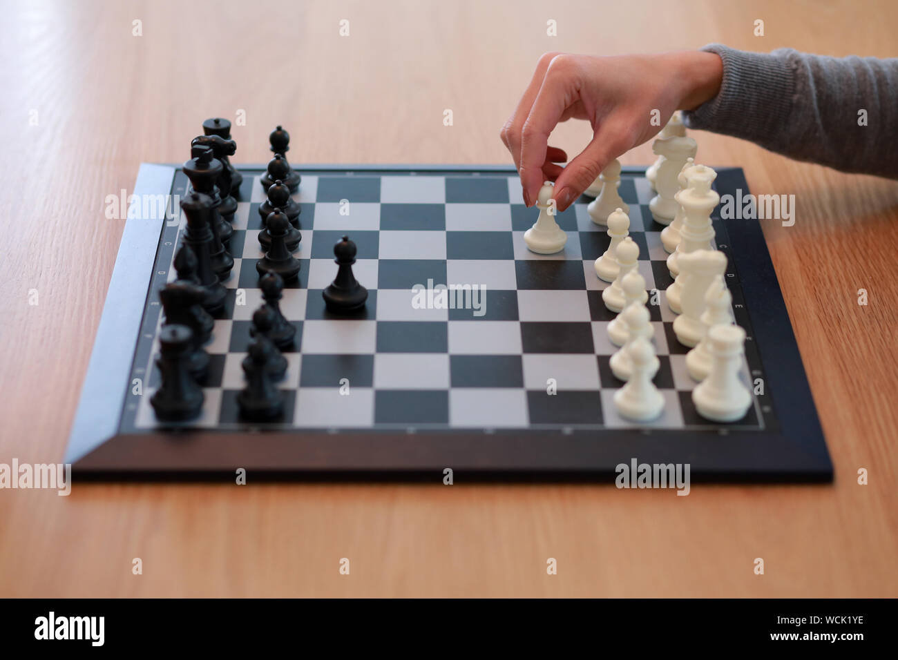 Hand holding chess pawn hi-res stock photography and images - Alamy