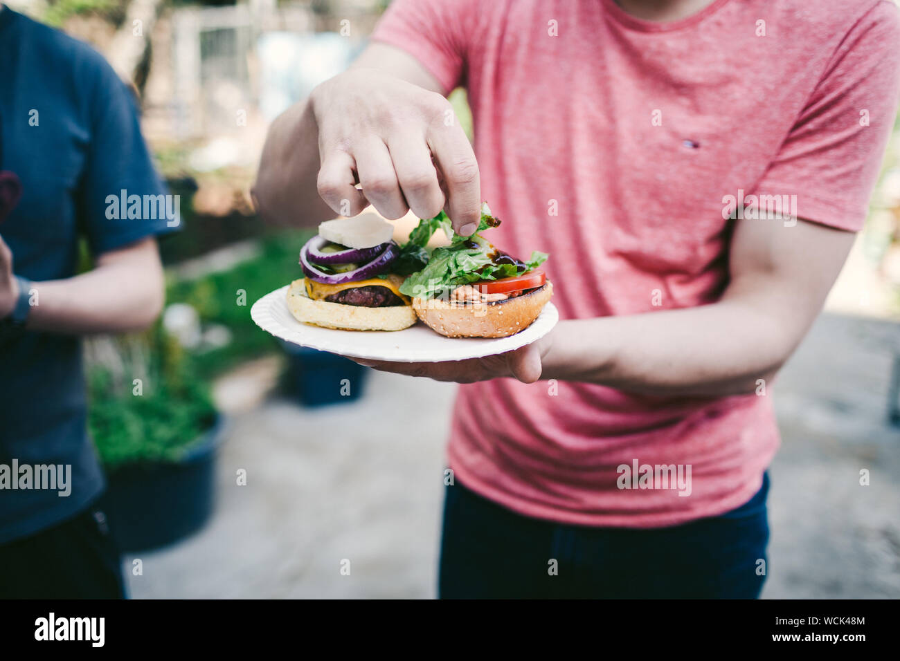 Man eating burger in fast food hi-res stock photography and images - Alamy